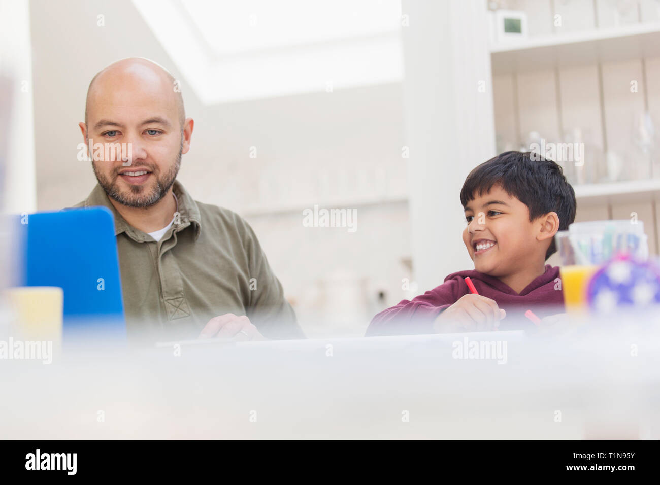 Two boys using laptop home hi-res stock photography and images - Alamy