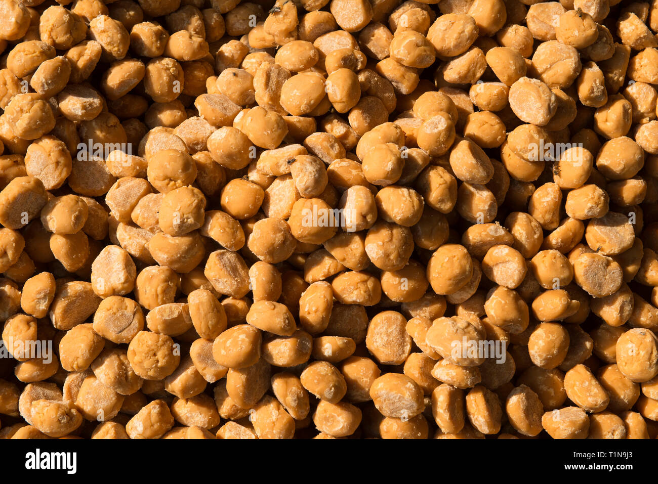 Pure cane sugar pebbles, produced by traditional methods in rural India ...