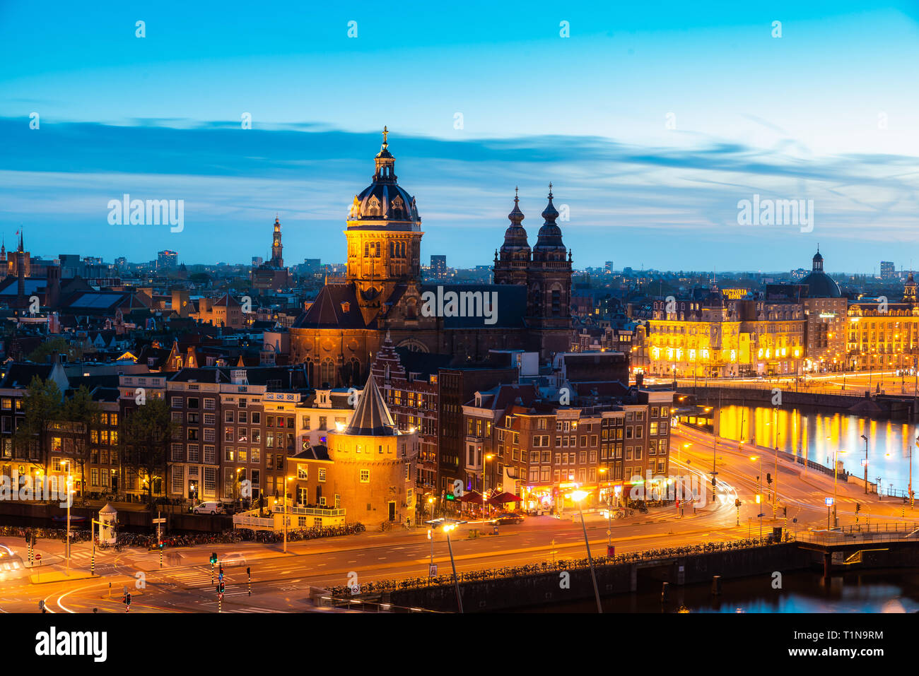 Aerial view of Amsterdam skyline in historical area at night in ...