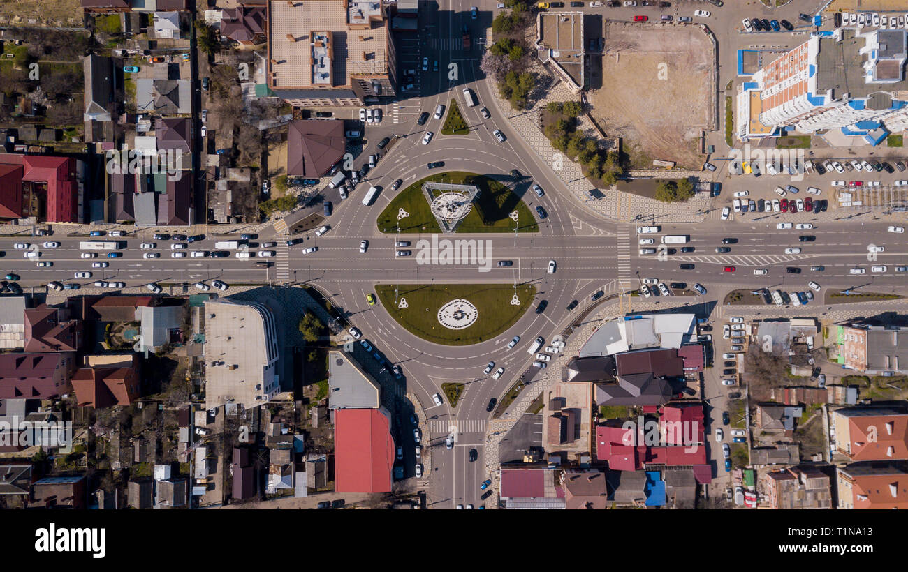 Top down view of urban road traffic, roundabout, junction route traffic ...
