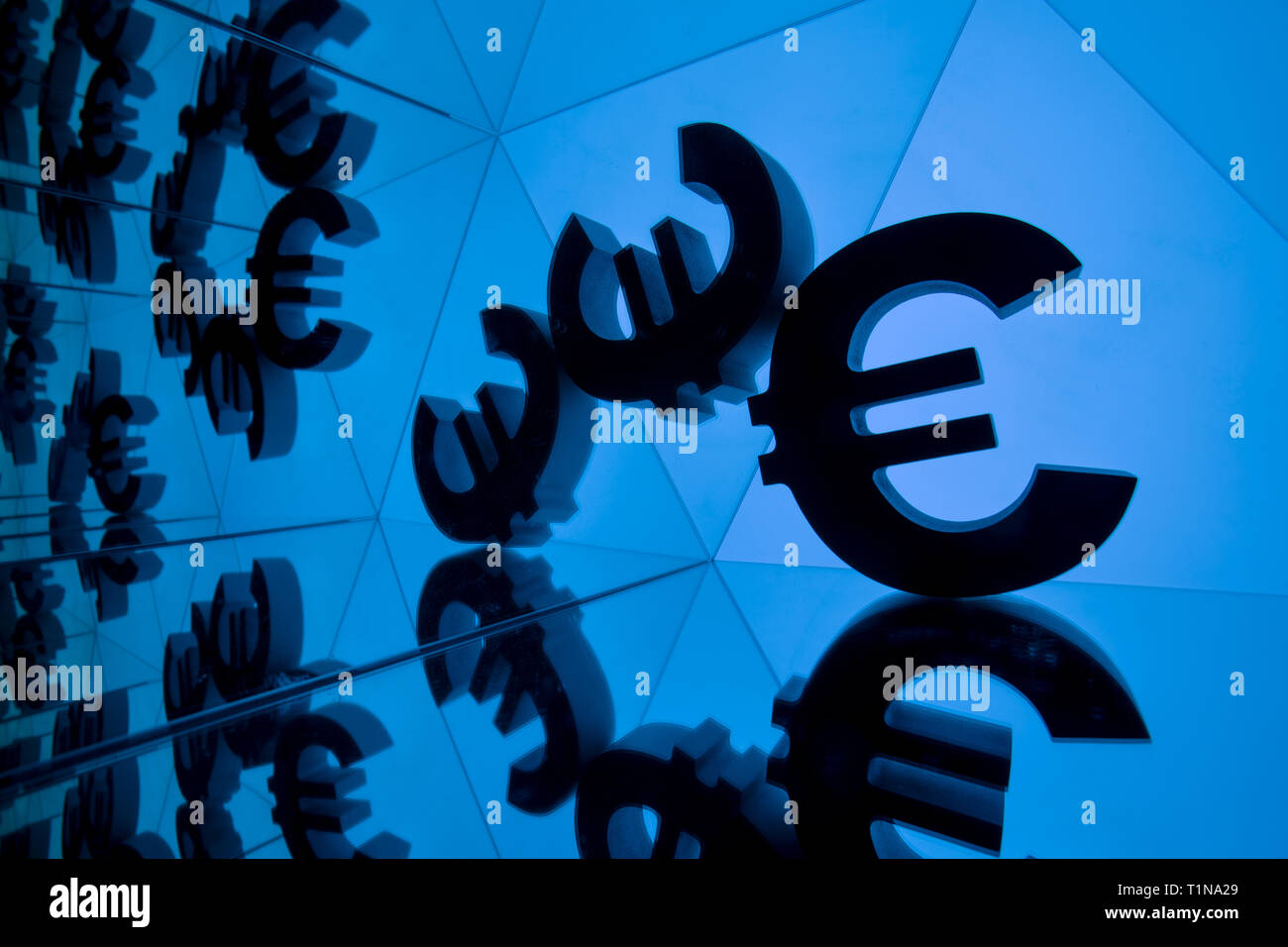 Euro Currency Symbol With Many Mirroring Images of Itself on Blue ...