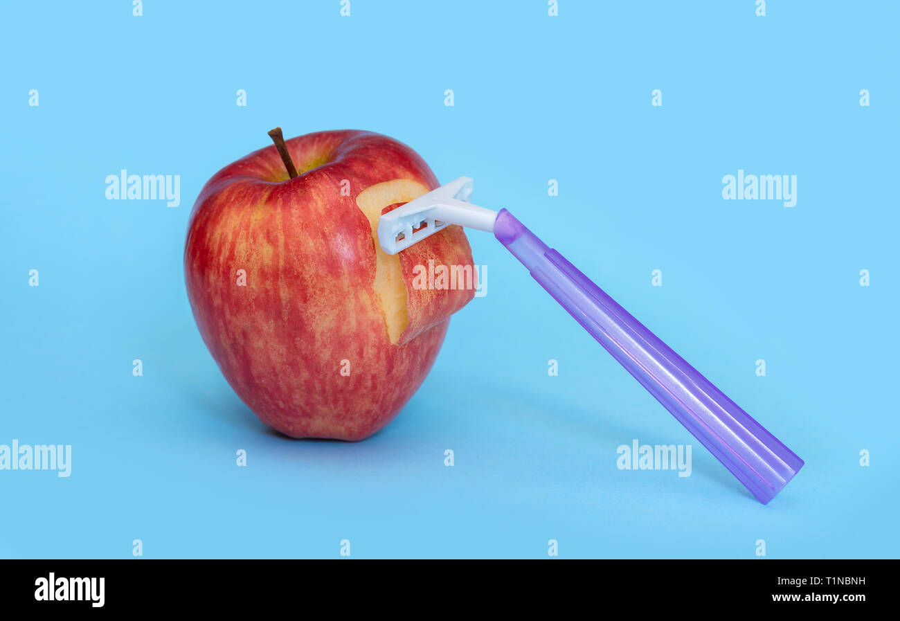 apple with shaving foam and disposable razor as a concept for gentle ...