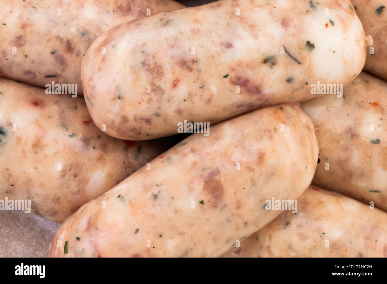 Raw pork sausages texture background, top view Stock Photo - Alamy