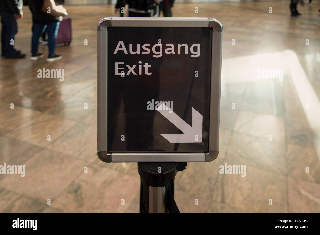 Bilingual exit sign at international airport or bank Stock Photo - Alamy