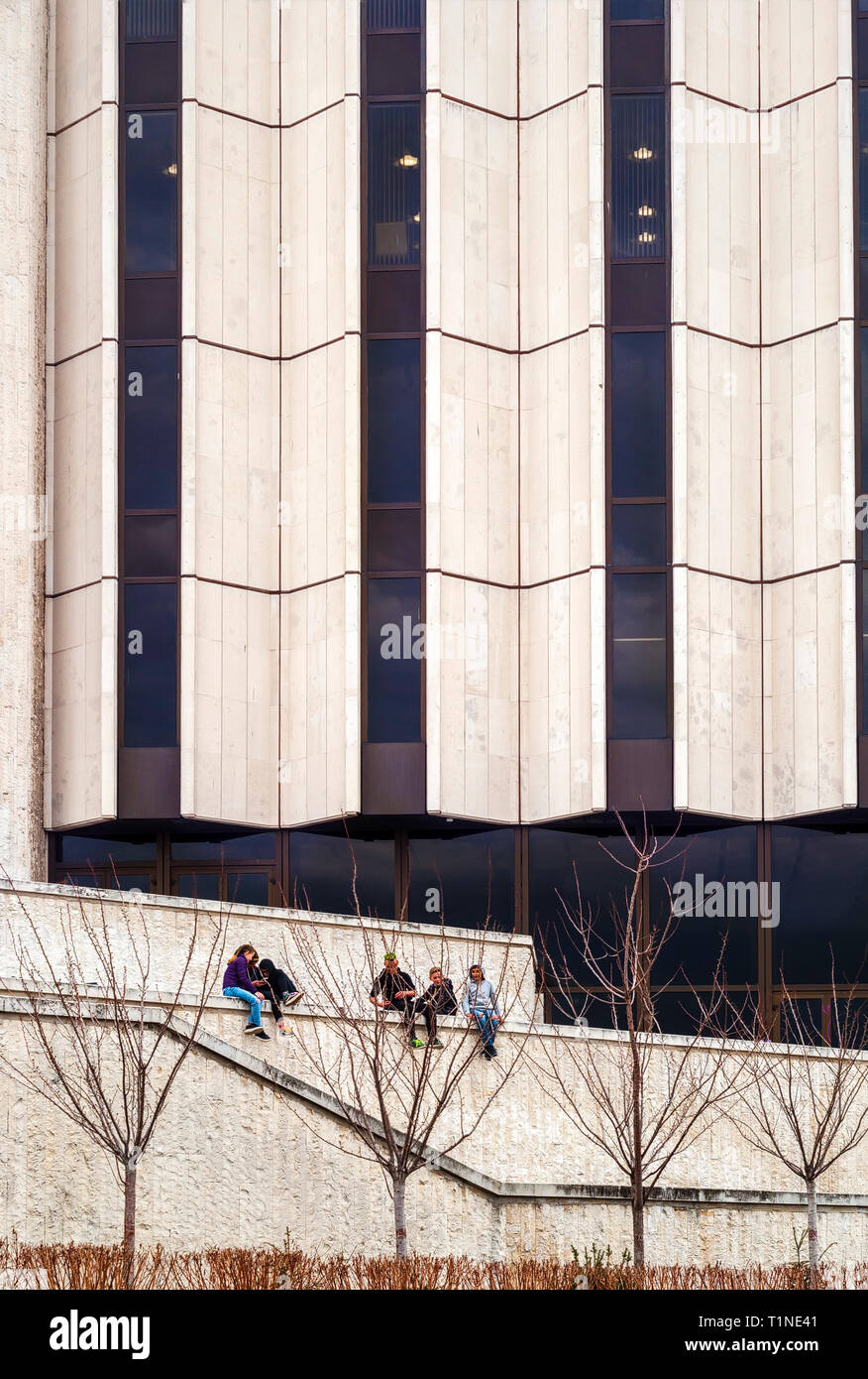 Young people having fun in front of a high public building Stock Photo ...