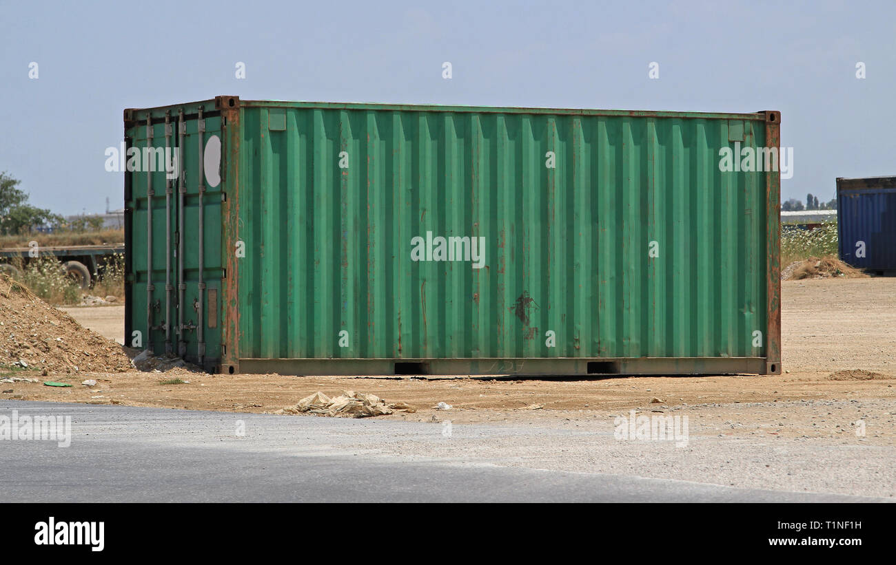One Green Cargo Shipping Container at Field Stock Photo - Alamy