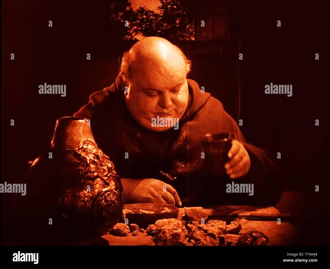 Happy fat monk at meal time Stock Photo - Alamy