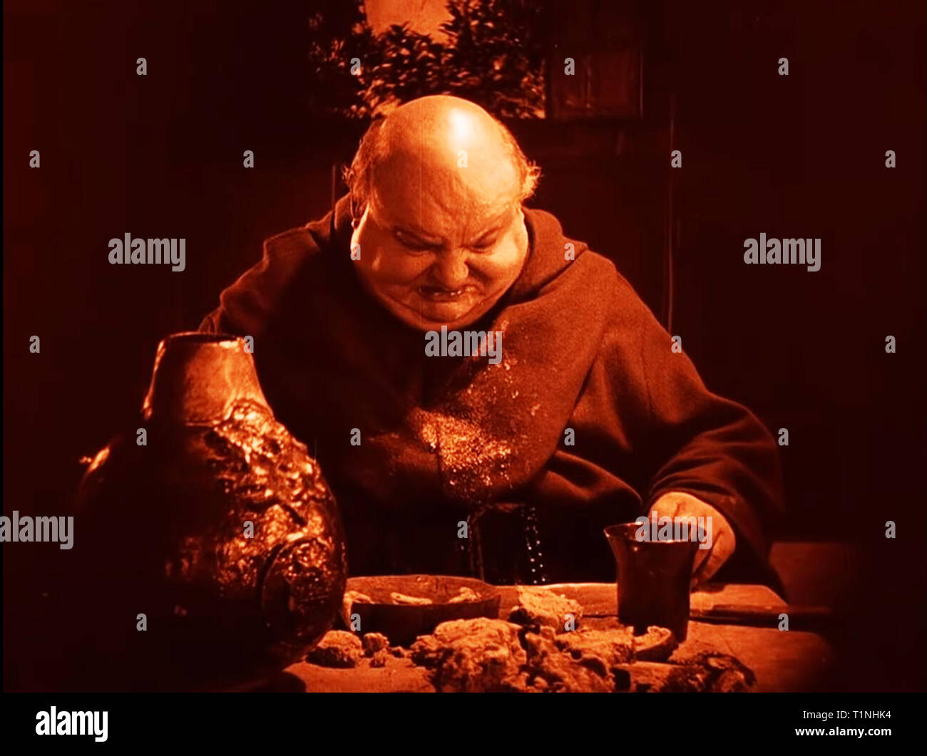 Happy fat monk at meal time Stock Photo - Alamy