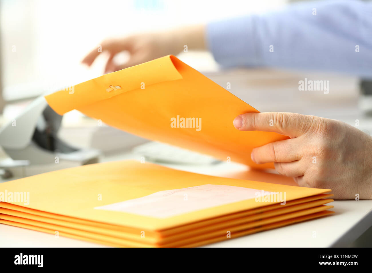 Post envelope hand man hi-res stock photography and images - Alamy