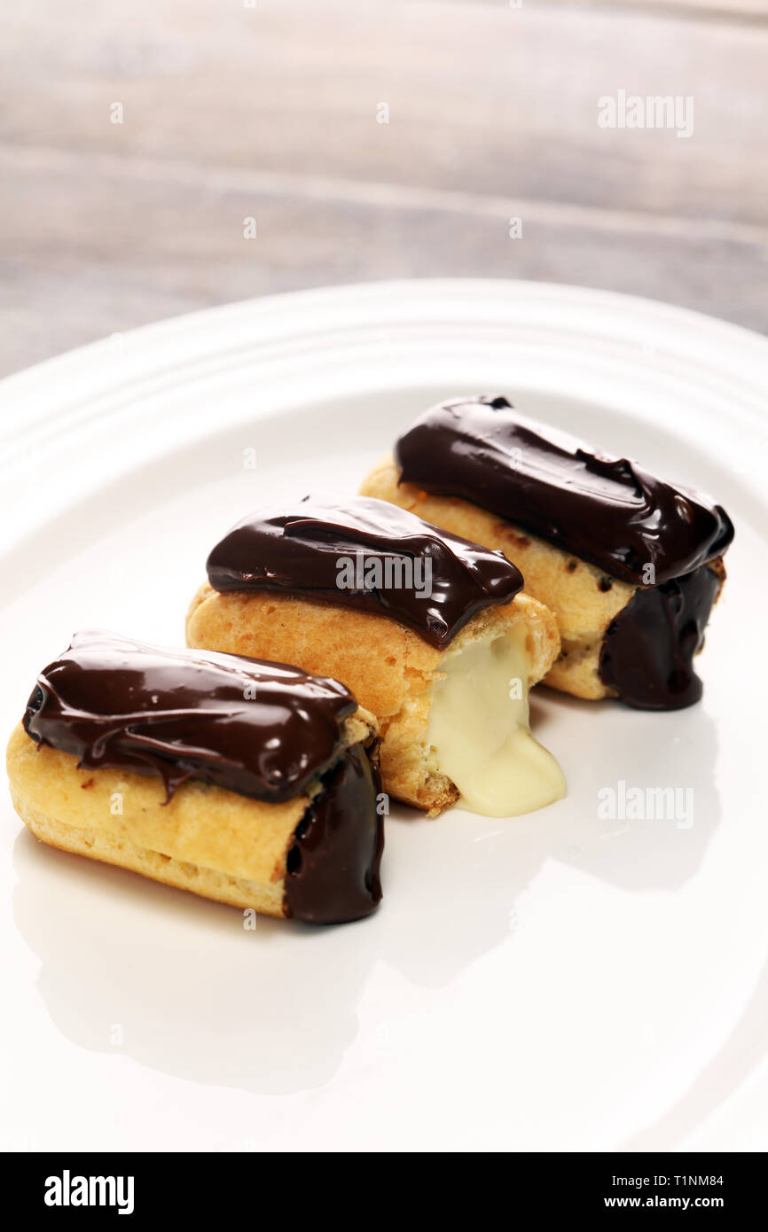 Traditional French dessert. Eclair with chocolate icing. Pastery ...