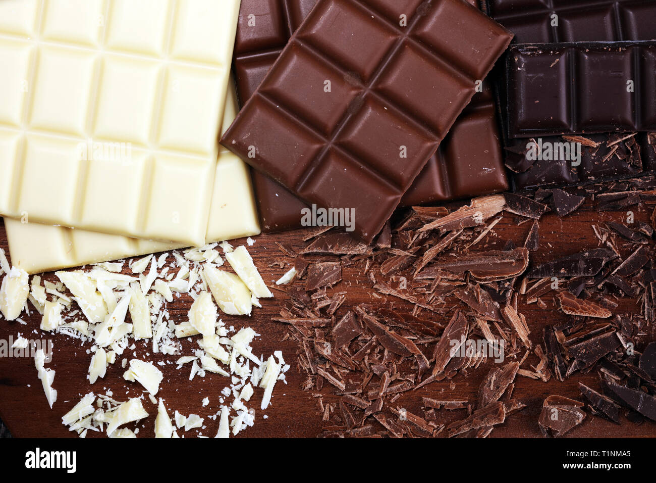 chocolate in diffrent color. milk, dark and white chocolate bars and ...