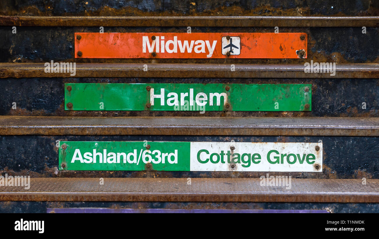 Old metal stairs with various colorful signs of places in Chicago city ...