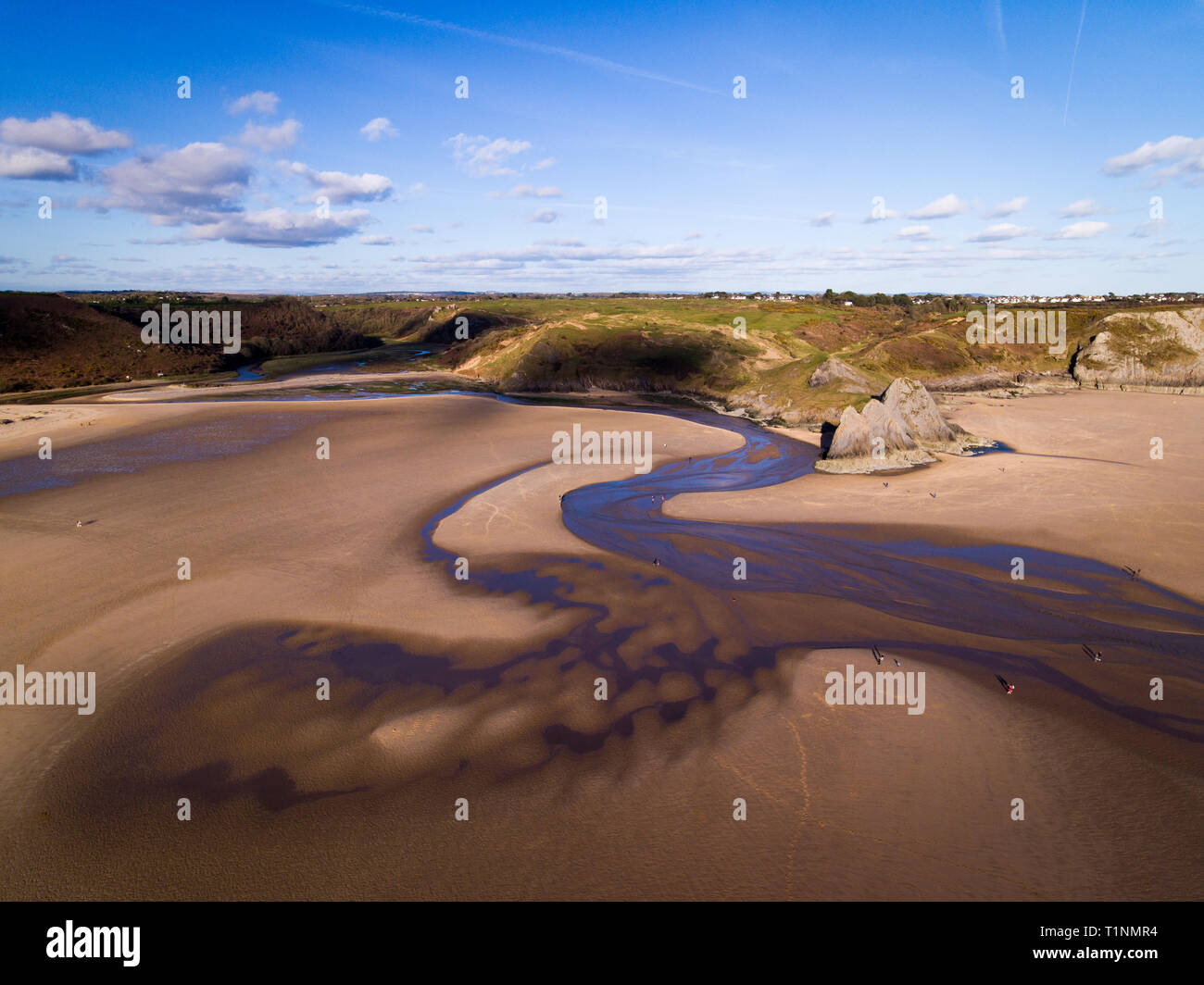 Aerial view of Three Cliffs Bay south coast beach the Gower Peninsula ...