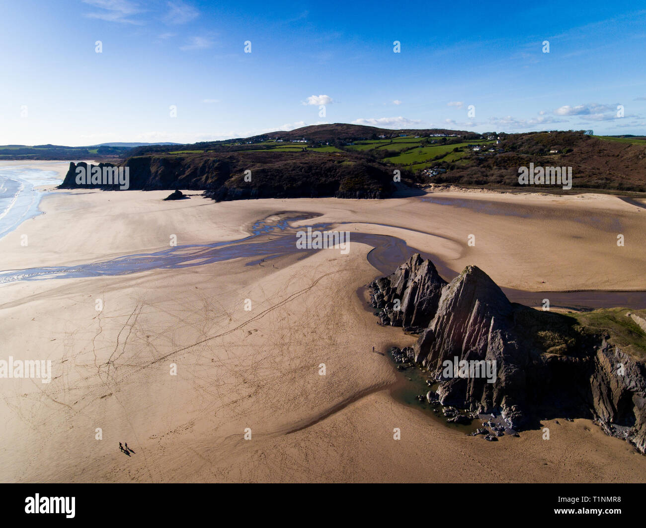 Aerial view of Three Cliffs Bay south coast beach the Gower Peninsula ...