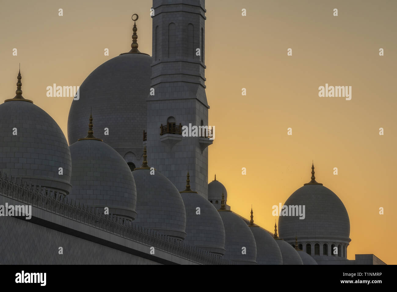Arabic mosque facade with domes, with sunset light. Great Mosque. UAE ...