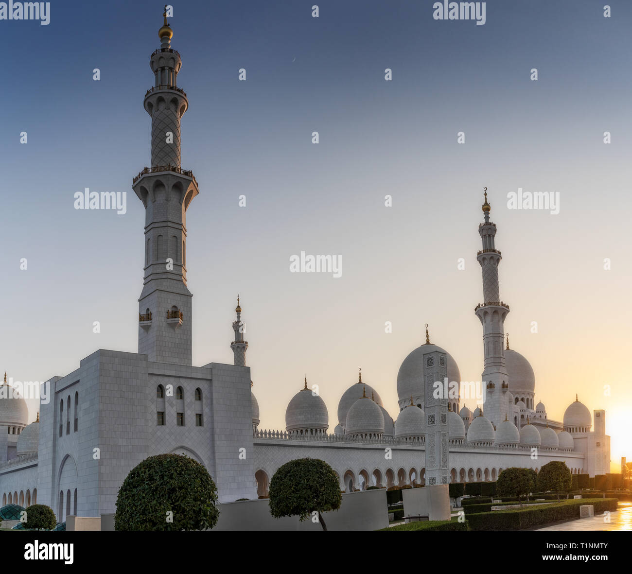 Arabic mosque facade with domes, with sunset light. Great Mosque. UAE ...