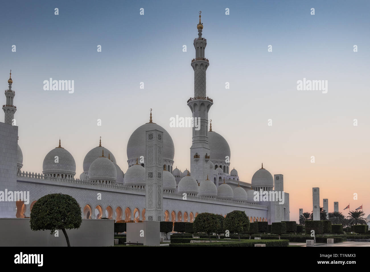 Arabic mosque facade with domes, with sunset light. Great Mosque. UAE ...