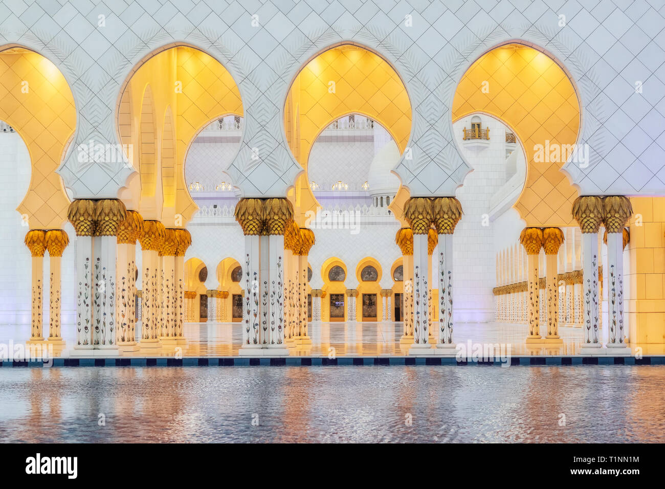 Arabic mosque arch, with yellow lights light.Great Mosque. UAE. Abu ...