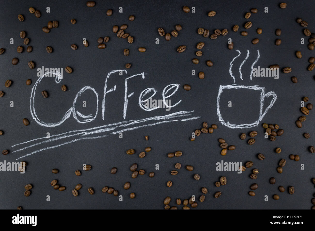 Coffee drawn chalk on a blackboard and scattered grains Stock Photo - Alamy