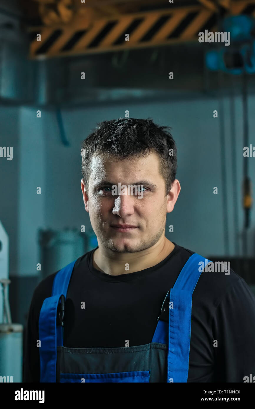 Working man in overalls looks hi-res stock photography and images - Alamy