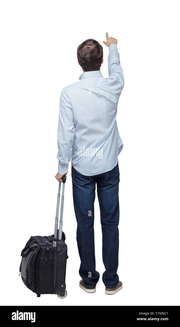 Back view of pointing business man with suitcase. Standing young guy ...