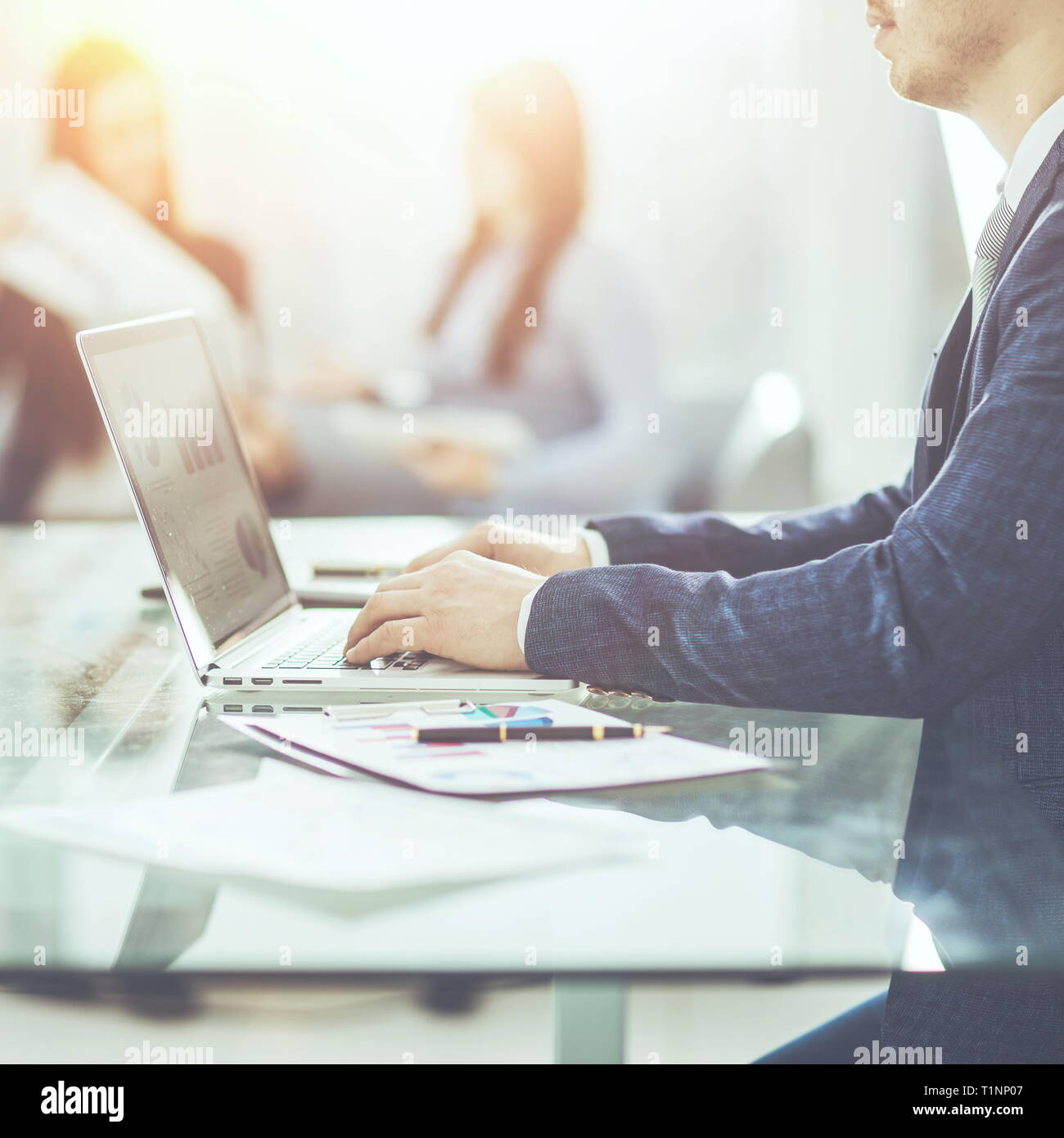 financial managers working on laptop with financial data at the ...