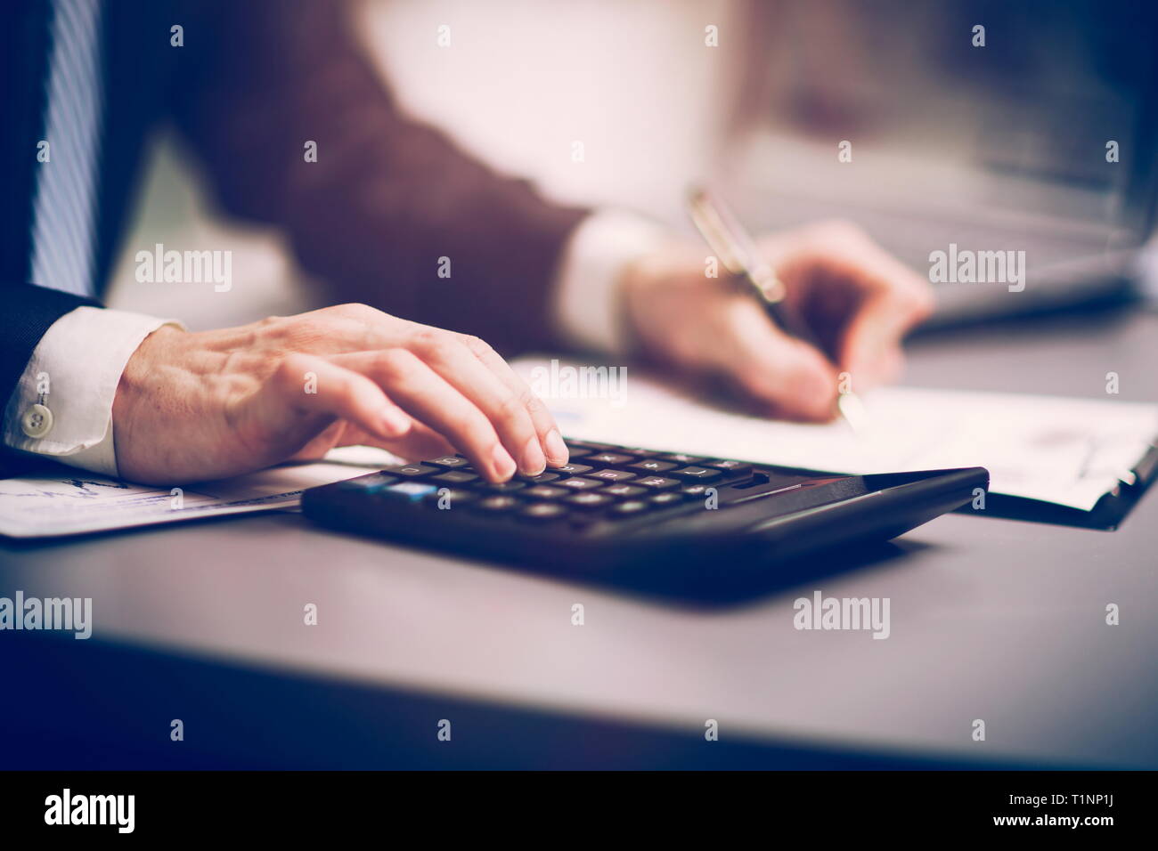 The businessman makes his own accounting, a financial report using a ...