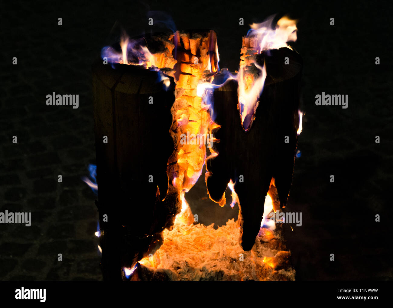 Burning log from inside Stock Photo - Alamy