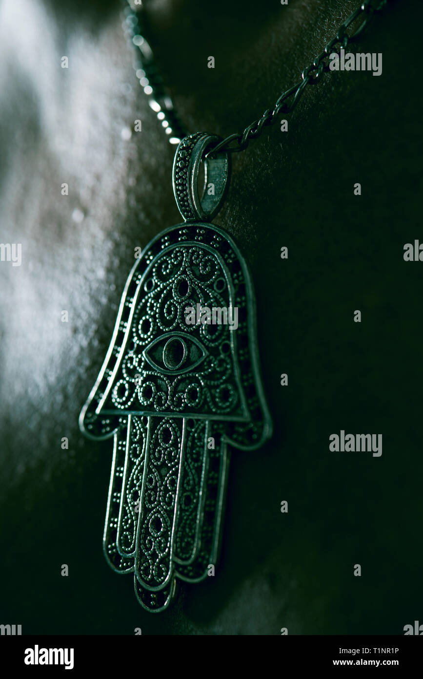 closeup of an old hamsa amulet, also known of the hand of fatima or the ...