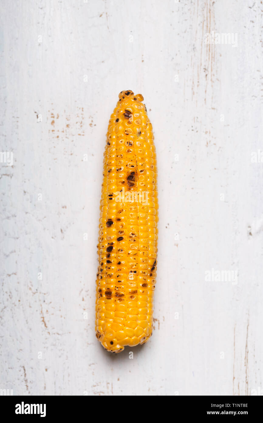 Grilled corn cobs on the old vintage table. Tipical american food Stock ...