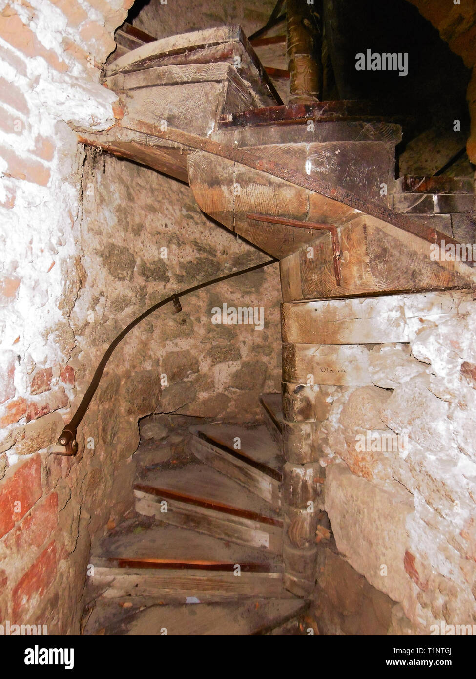 Ancient spiral staircase in the medieval castle leading to the tower ...