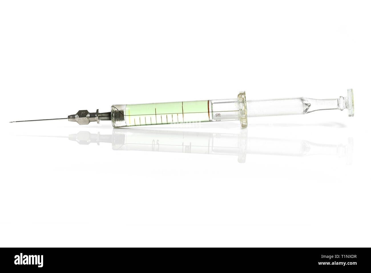 glass syringe filled with green liquid isolated on white background ...