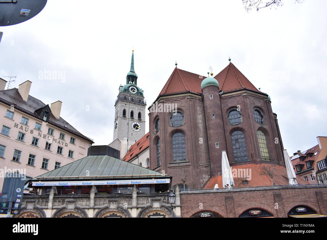 The "alter Peter" and a church in the downtown of munich Stock Photo ...