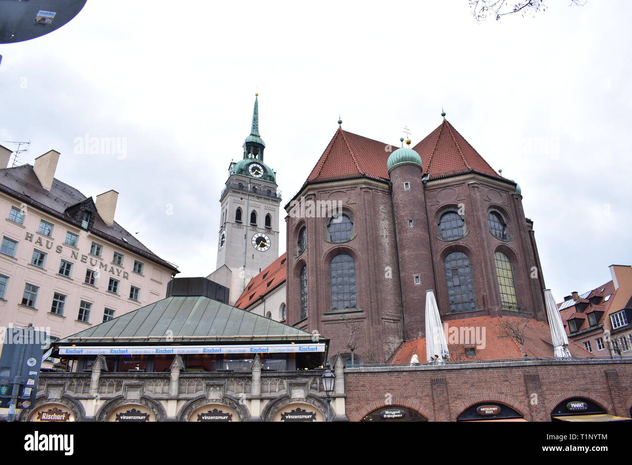 The "alter Peter" and a church in the downtown of munich Stock Photo ...