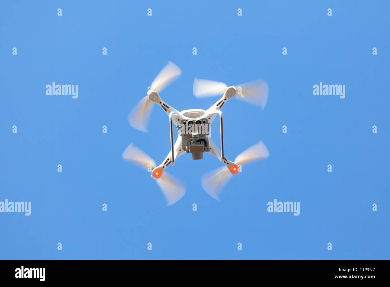 Flying drone with blue sky background, new technology Stock Photo - Alamy