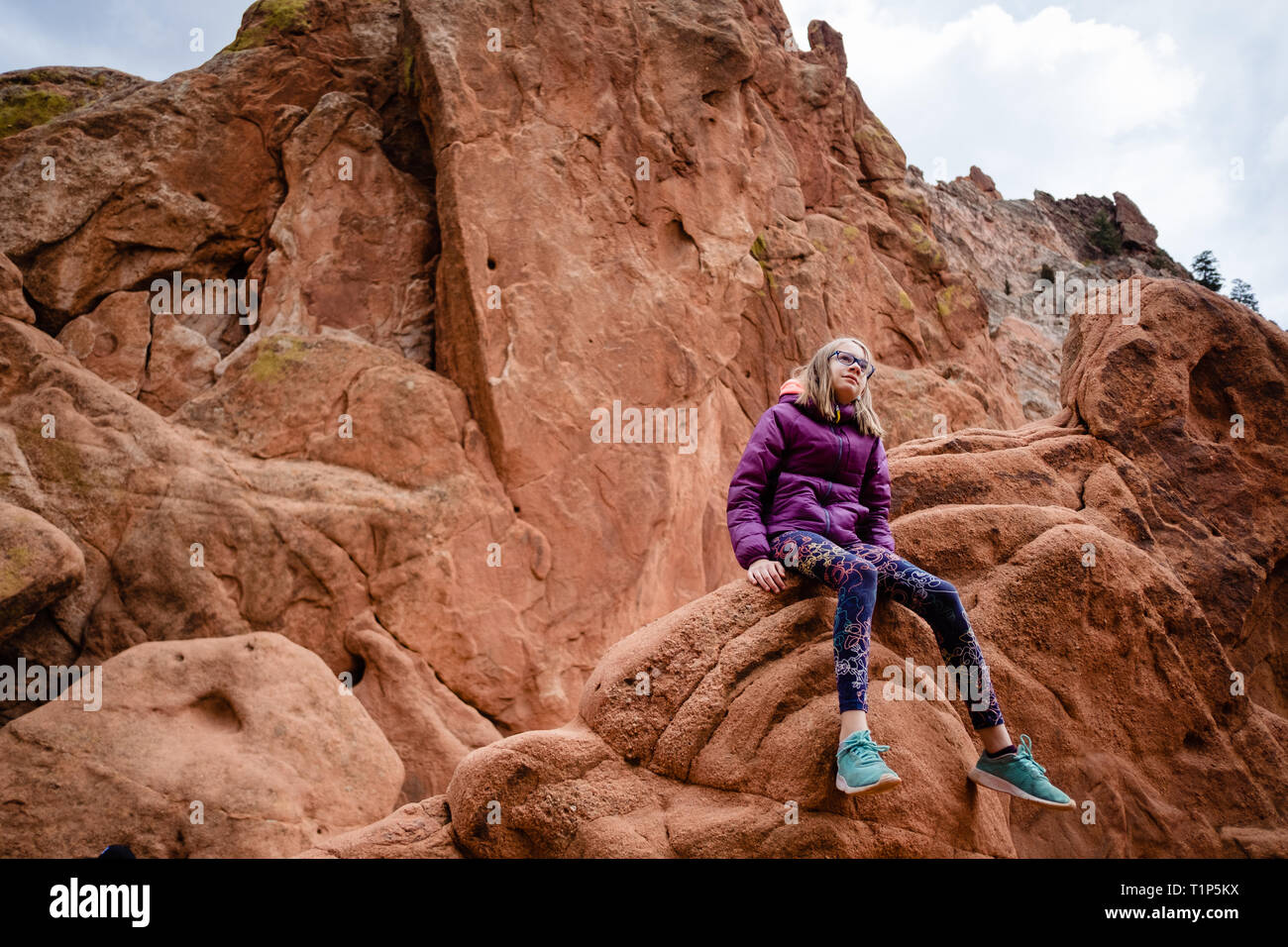 Girl on rocks hi-res stock photography and images - Alamy