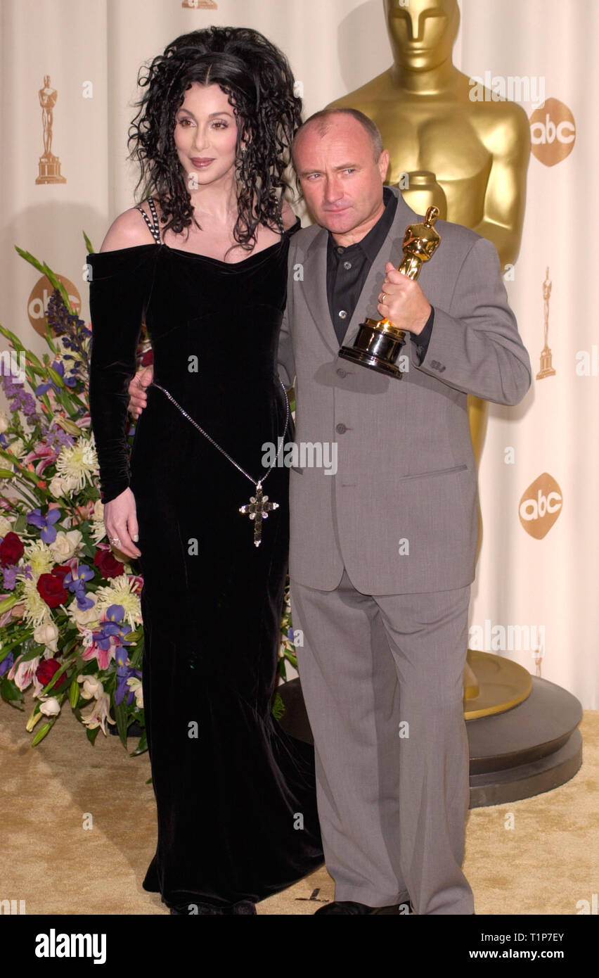 LOS ANGELES, CA. March 26, 2000: Pop stars Phil Collins & Cher at the ...