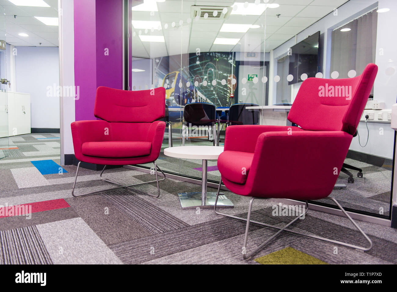 office space with designer office chairs Stock Photo - Alamy