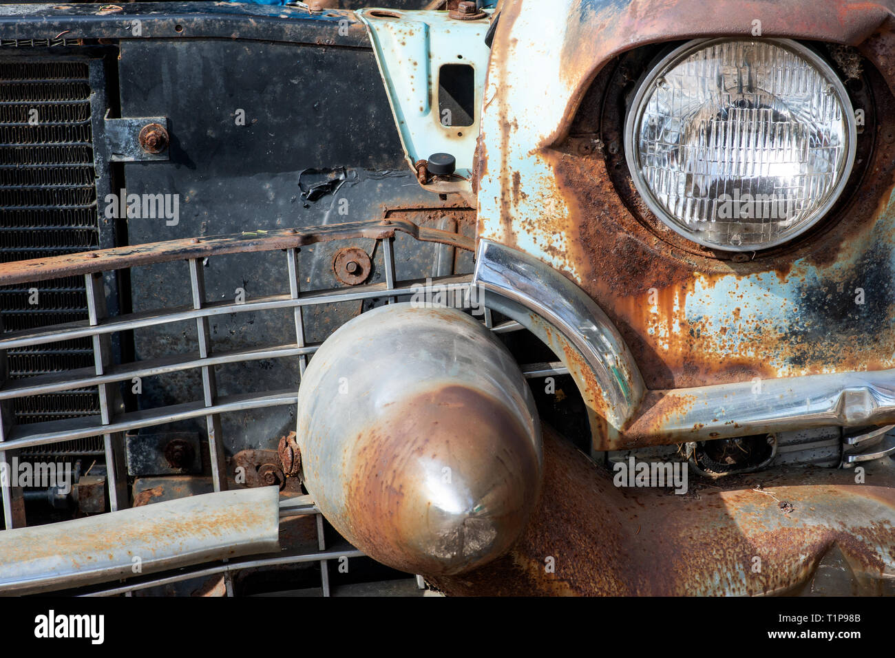 Old rusty and damaged antique car wreck in very poor condition on house ...
