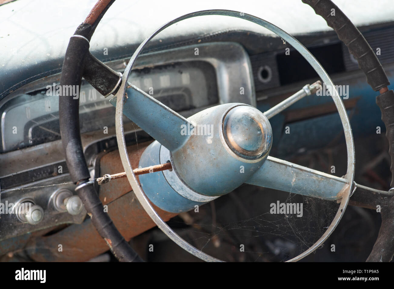 Old rusty and damaged antique car wreck in very poor condition on house ...