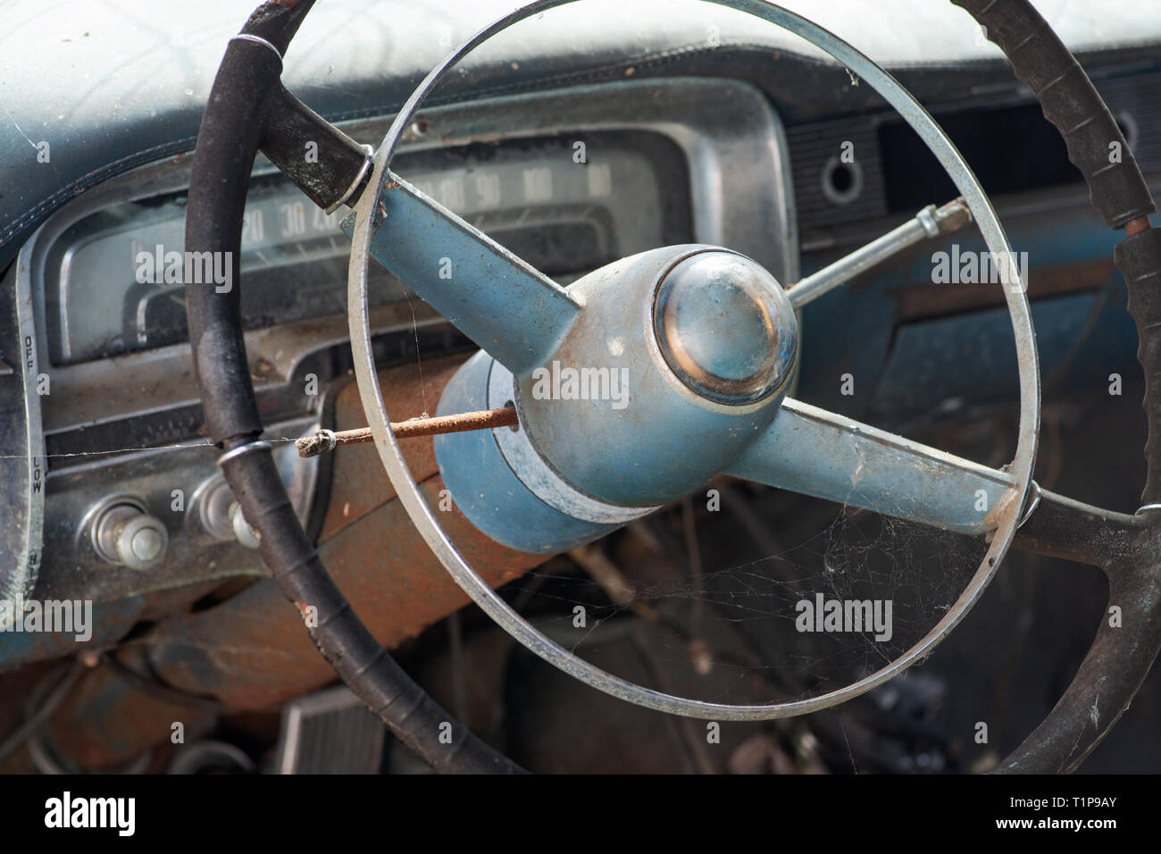 Old rusty and damaged antique car wreck in very poor condition on house ...