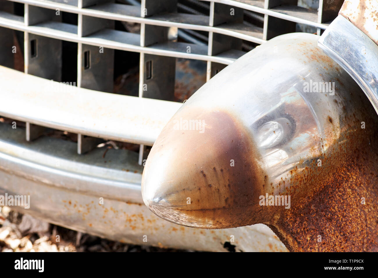 Old rusty and damaged antique car wreck in very poor condition on house ...