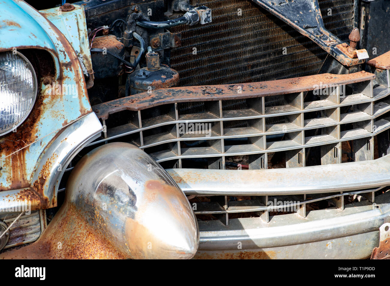 Old rusty and damaged antique car wreck in very poor condition on house ...
