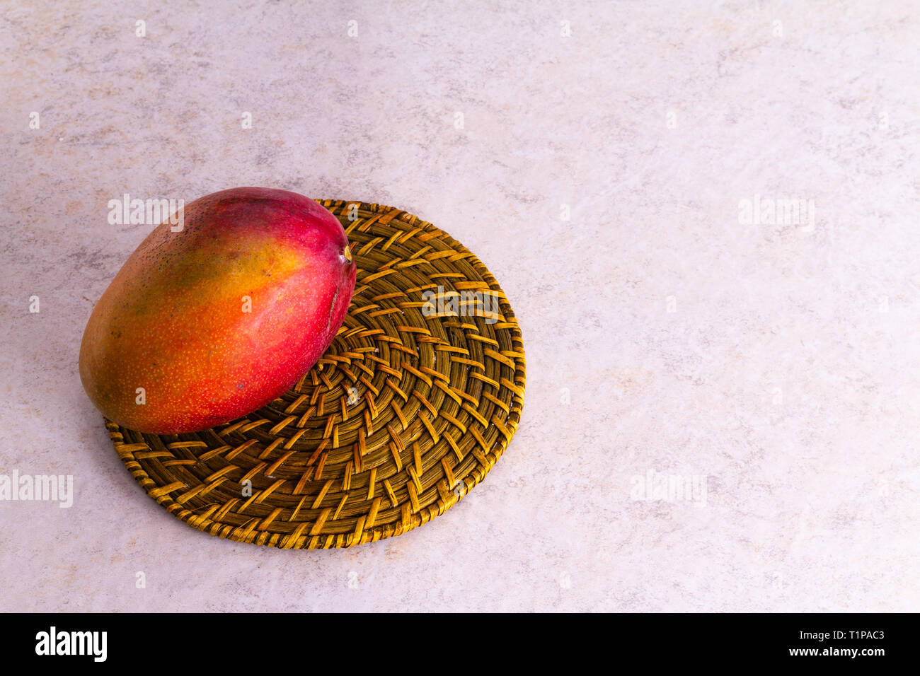 Mango with textured background Stock Photo - Alamy