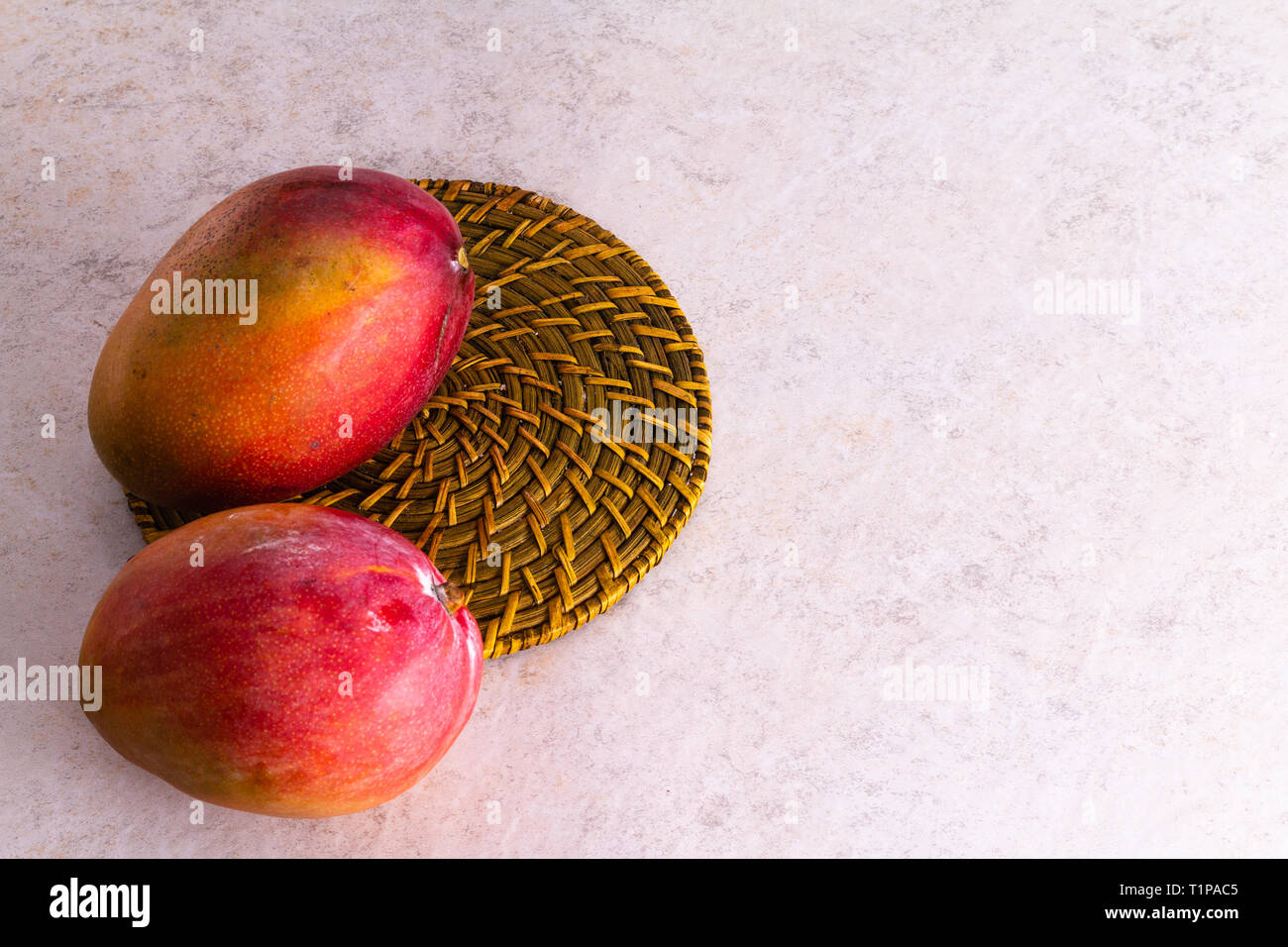Mango with textured background Stock Photo - Alamy