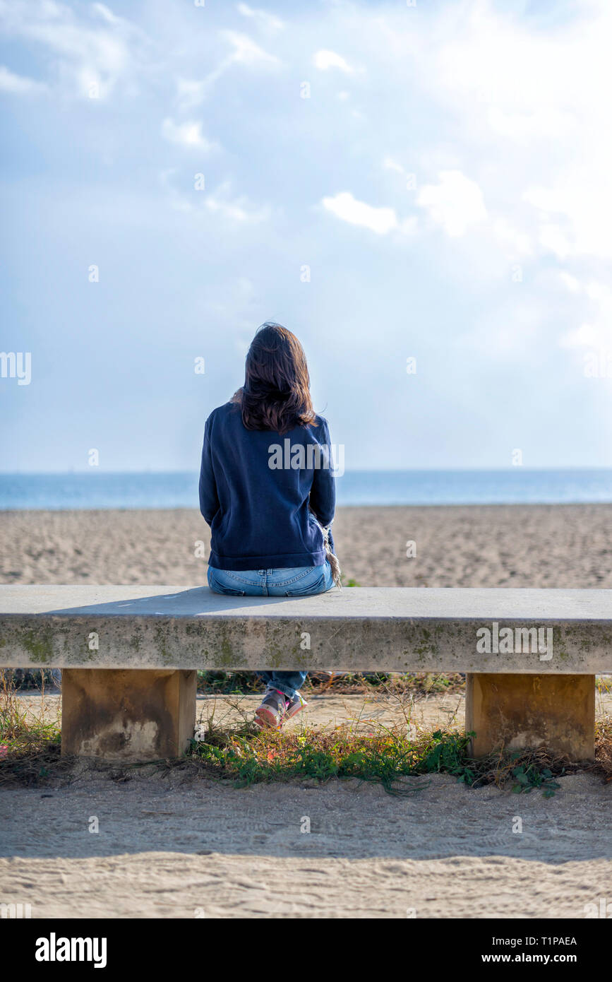 Sitting on bench rear view hi-res stock photography and images - Alamy