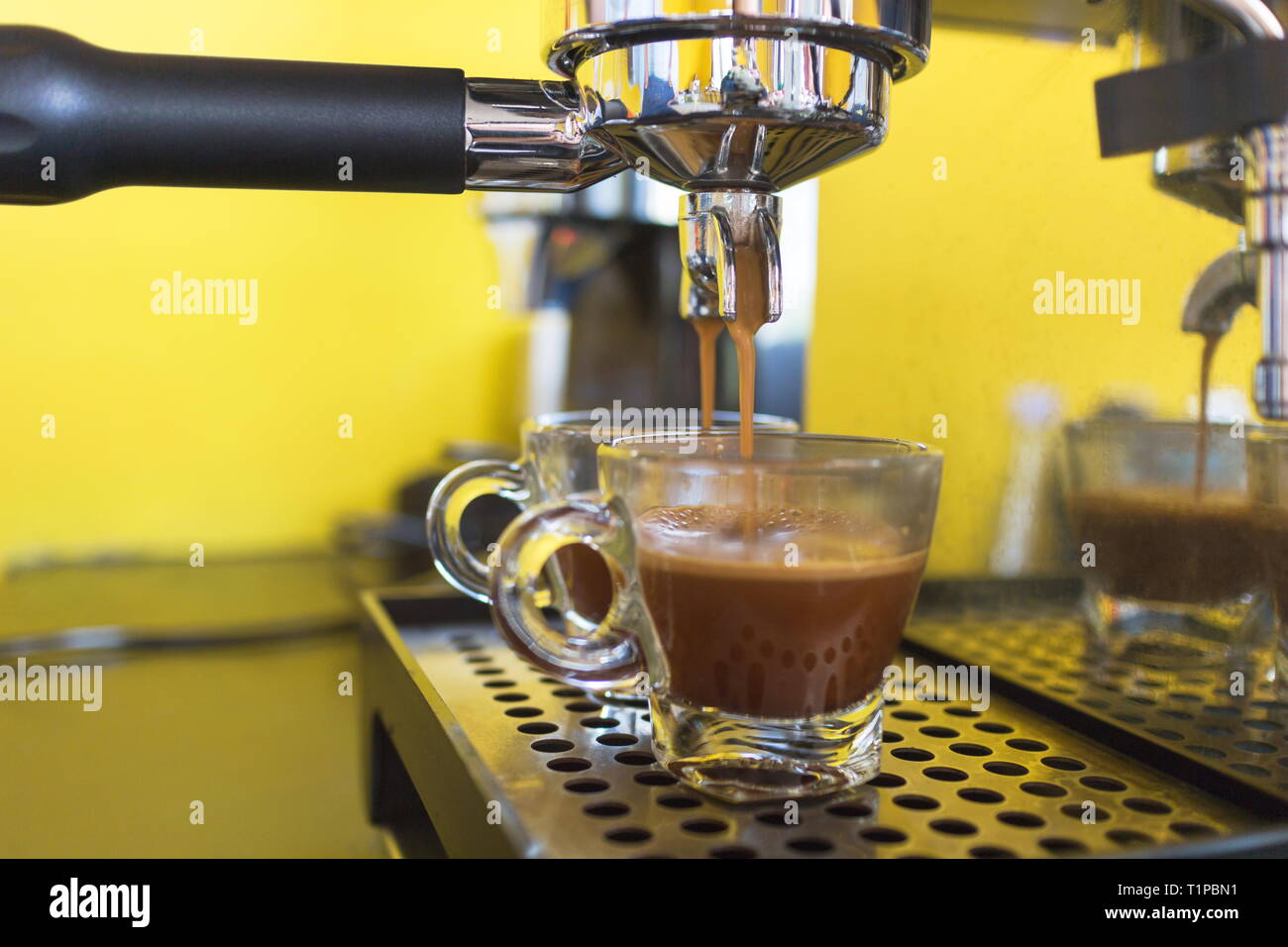 Espresso machine pouring cups of coffee hi-res stock photography and ...