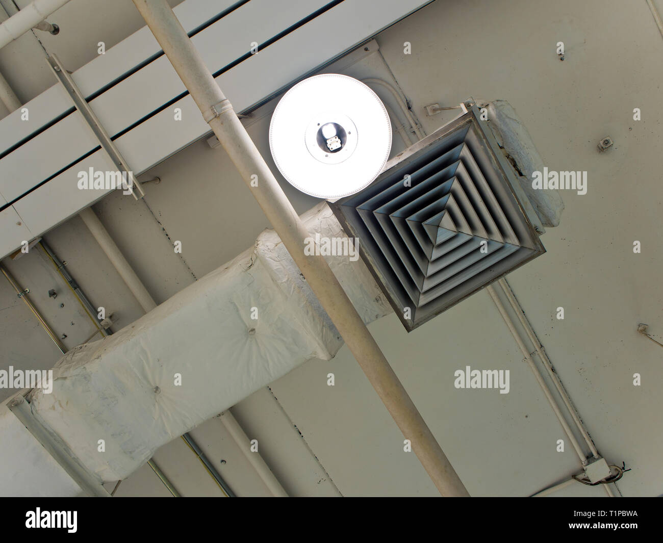 Mask of air duct and lamp on ceiling Stock Photo - Alamy