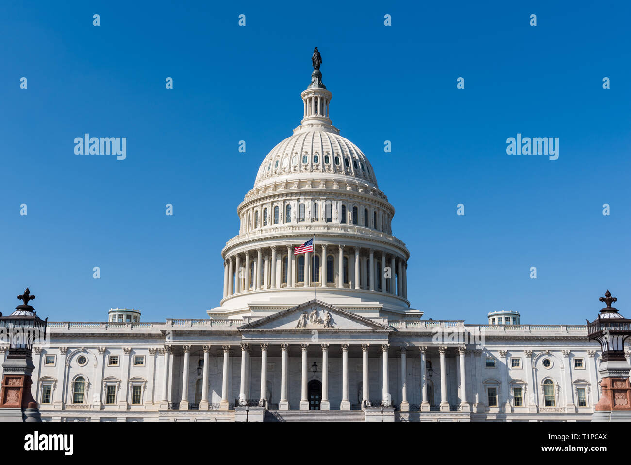 Us capitol with american flag hi-res stock photography and images - Alamy