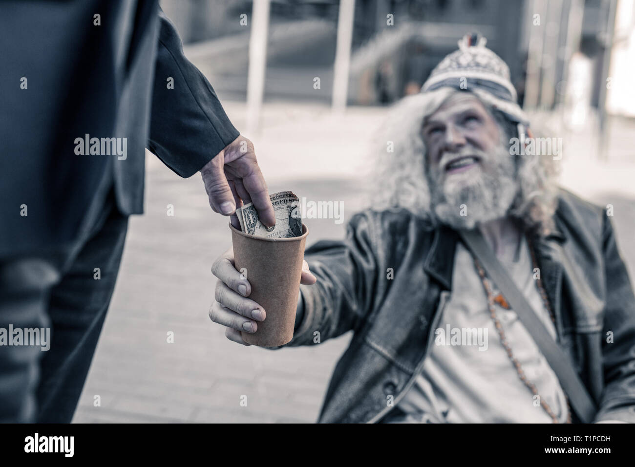 Thankful homeless man with dirty hair stretching empty coffee cup Stock ...